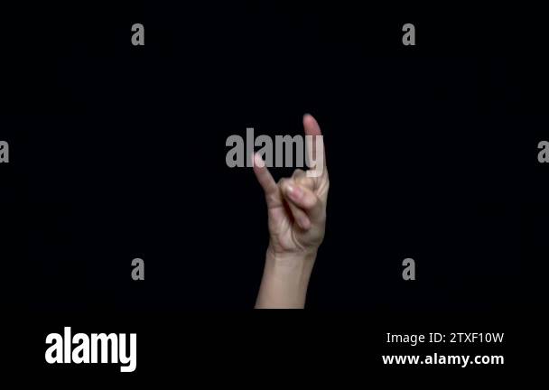 Female hand showing rock anf roll sign or three fingers in front of ...