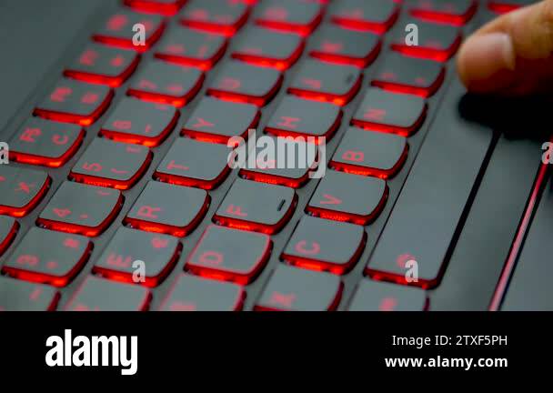 Keyboard of a gaming PC, with red lights. The lights can change in ...