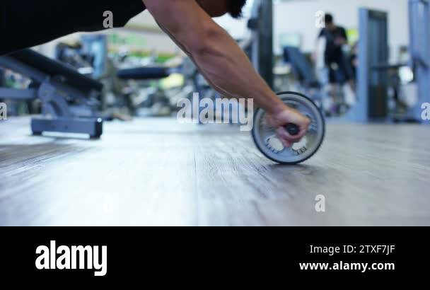 Guy bodybuilder in the gym, works with a barbell, bench press ...