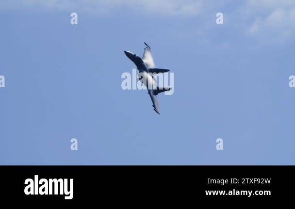 Mlitary aircraft su35 making loop and maneuver with smoke and steam on ...