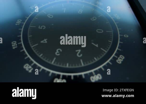 Modern compass determining the location in open sea aboard of up-to ...