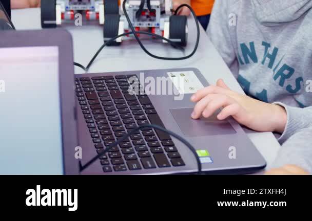 close-up, keyboard, child hands working on laptop. students create ...