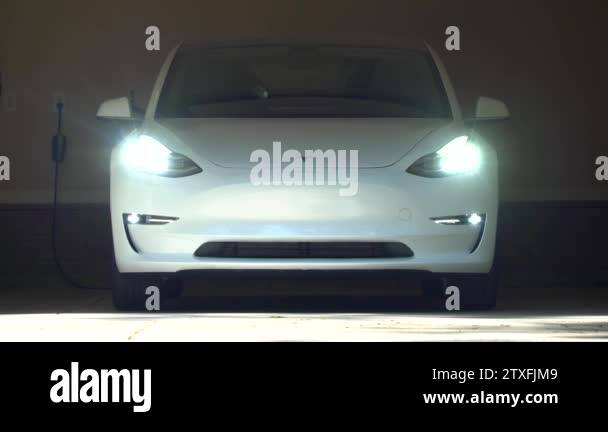 A brand new white Tesla Model 3. The model 3 is set to be the Teslas ...