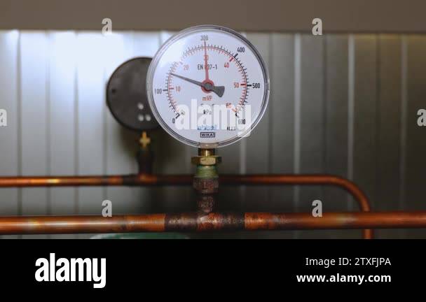 Close up work of a differential pressure manometer with tube spring ...