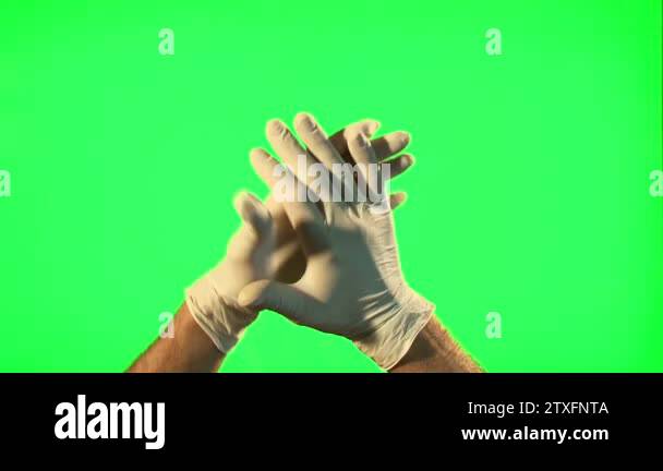 Male hands with surgical gloves clapping on green screen Stock Video ...