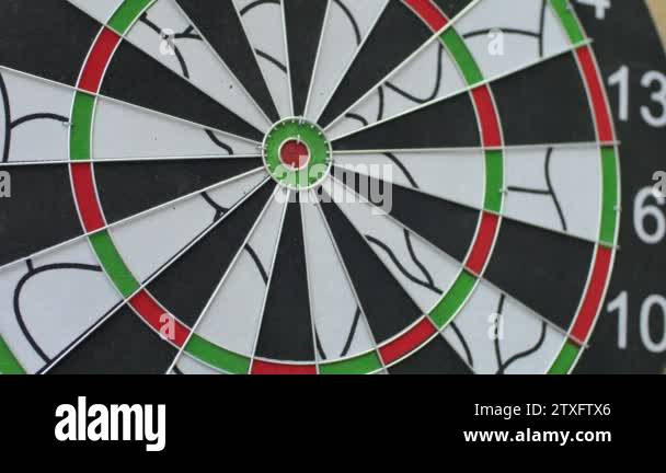 Game of darts on classic dartboard, two darts hit the bullseye and one ... Game of darts on classic dartboard, two darts hit the bullseye and one ...