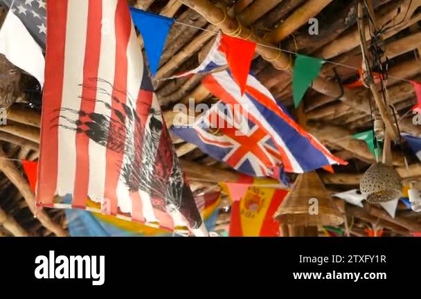 Decorative national flags of different countries hanging on strings in ...