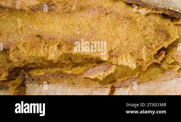 Macro shot, peanuts and a drop of oil falling on them, as a symbol of a ...