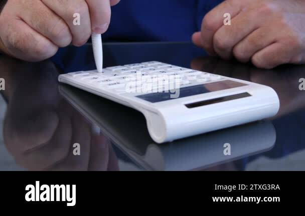 Man Hands Image on the Desk Calculating Using a Pen and Adding Machine ...