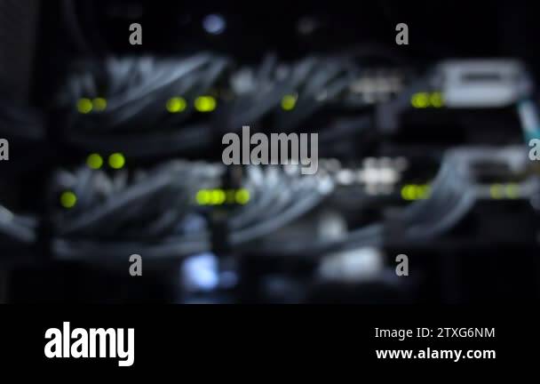 Ethernet Network Connection Hub. Blinking lights in a dark server room, Close-up view of ...