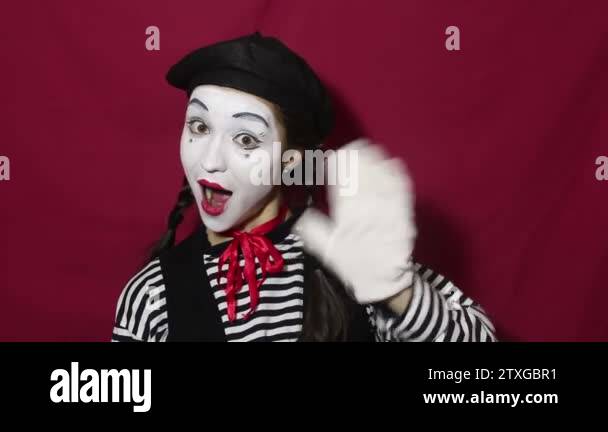 Close-up portrait of a young mime girl. Beautiful mime girl smiles and ...