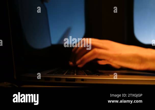 Freelancer woman hands typing on the laptop keyboard in the airplane in ...