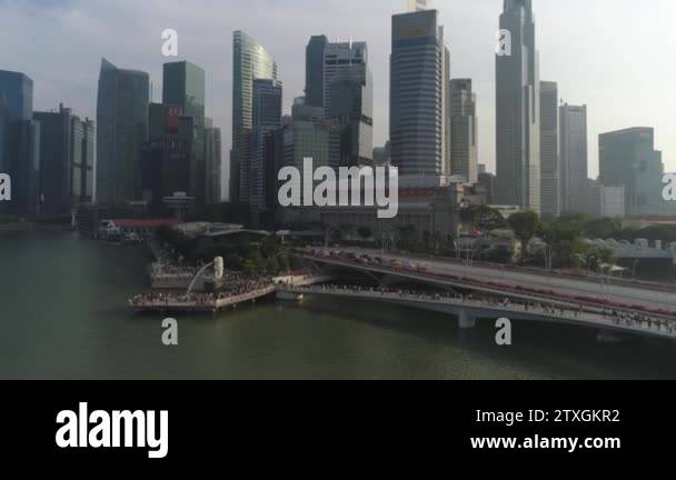 Famous fountain statue in Merlion Park and cityscape of Singapore. Shot ...