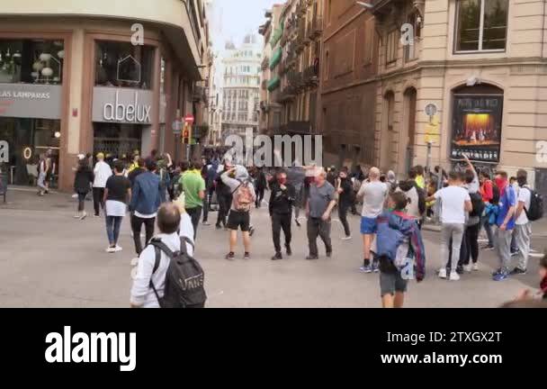 young people drag trash can along the road to build barricades during ...