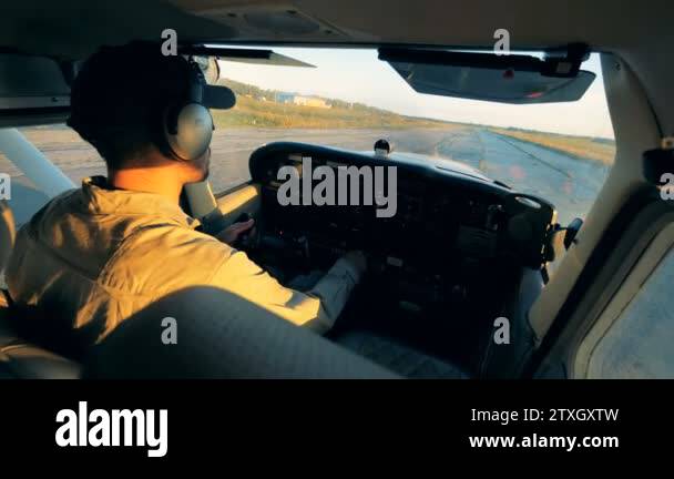 Pilot navigates a biplane on an airfield. Cockpit view Stock Video ...