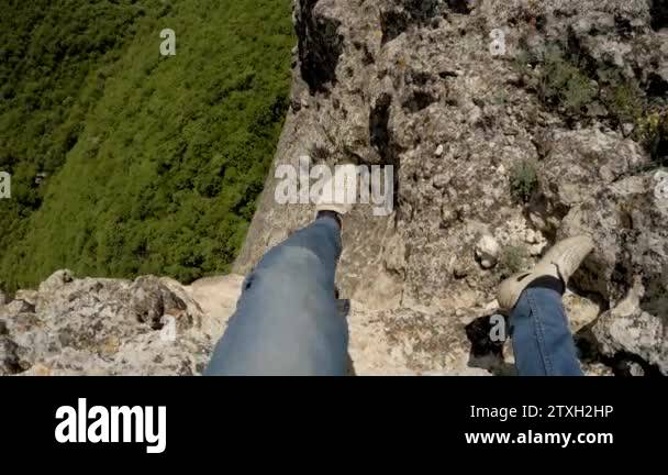 Dangling legs cliff Stock Videos & Footage - HD and 4K Video Clips - Alamy
