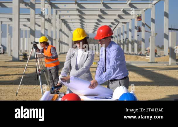 Engineer, Architect and Mature Businessman Checking the Construction ...