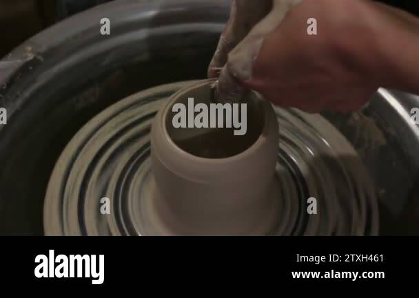 The master prepares the clay for work. The master's hands close-up ...