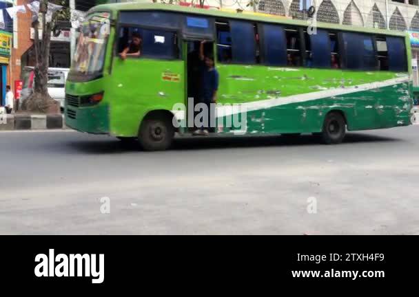 Unidentified people and street traffic at the Ring Road in the Adabor ...