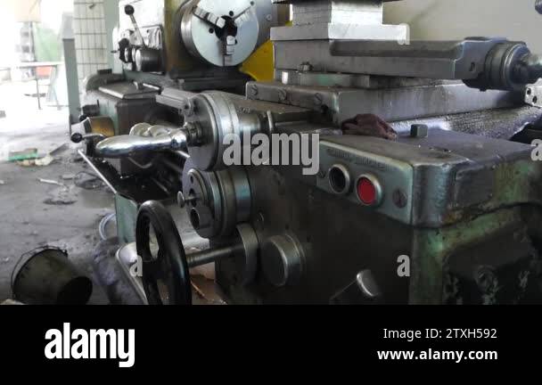 Old turning lathe machine. The old factory building prior to demolition ...