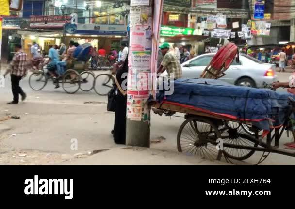Unidentified people and street traffic at the Ring Road in the Adabor ...