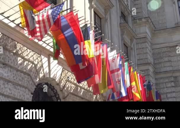 Flags of the OSCE participating States on the headquarters building in ...