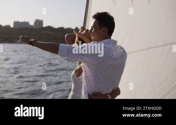 Sailing boat - Romantic young couple enjoying time together on small ...