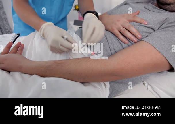 Doctor using syringe to make injection of vaccine to patient in ...