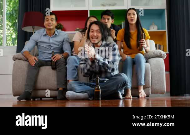 group of friends watching tv Stock Video Footage - Alamy