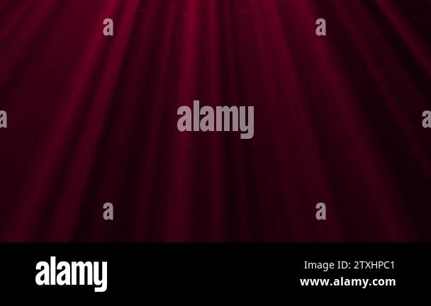 Volumetric rays of light shining from above penetrate through the thick ...