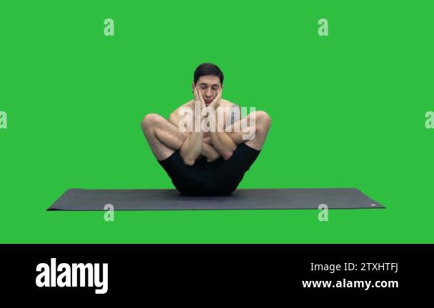 Practicing Yoga exercises Scale Pose - Tolasana on a Green Screen ...