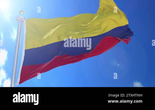 Colombia animated flag in the wind with blue sky in the background ...