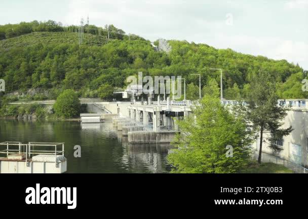 Water giant concrete dam, hydroelectric powerstation. View from the dam ...