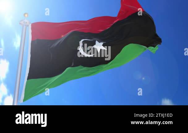 Libya animated flag in the wind with blue sky in the background, green ...