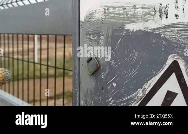 Painting the electrical panel with gray paint with lightning sticker on ...