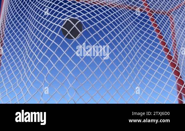 Goal Moment in Close-up. Hockey Puck Flies into Gates Grid Waving in ...