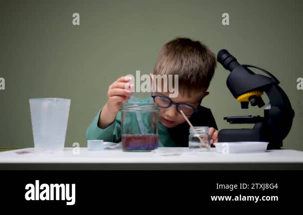 Alternative education. Kid doing experiments.Leisure activity indoors ...