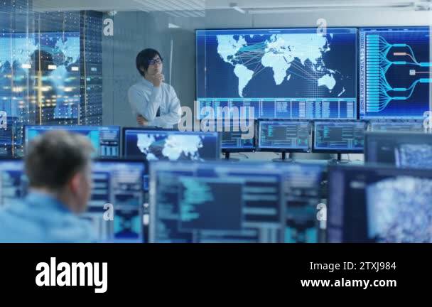 In the System Control Room Chief Engineer Thinks While Standing Before ...