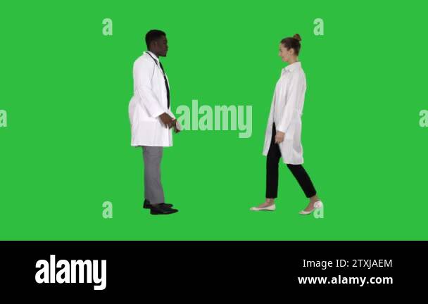 Nice to meet you Doctors meet and shake hands on a Green Screen, Chroma ...