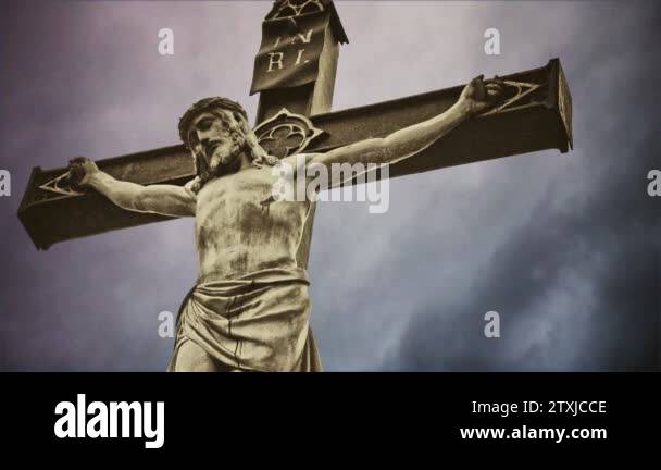 Crucifixion. Christian cross with crucified Jesus Christ statue over ...