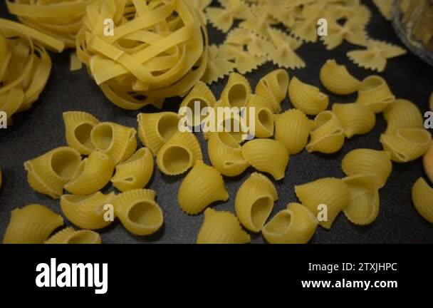 Background or texture of pasta close-up. Different types of pasta on ...