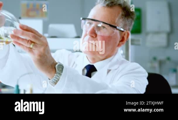 Attentive male scientist experimenting in laboratory 4k Stock Video ...