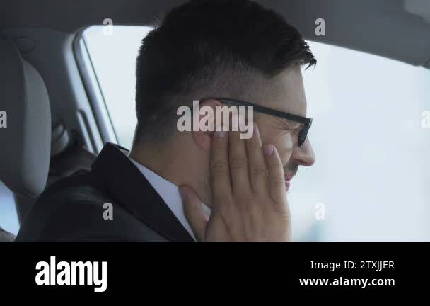 Sick male touching inflamed ear, suffering sharp pain attack, otitis ...