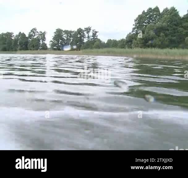 Lake water splashing on camera lens filmed aboard the motor boat Stock ...