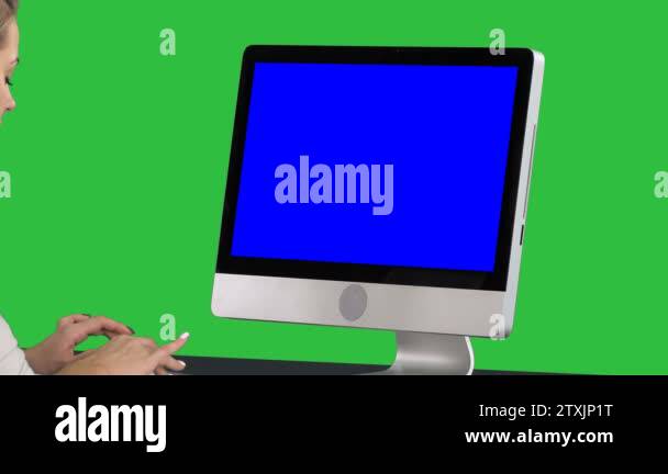 Woman using computer on a Green Screen, Chroma Key. Blue Screen Mock-up ...