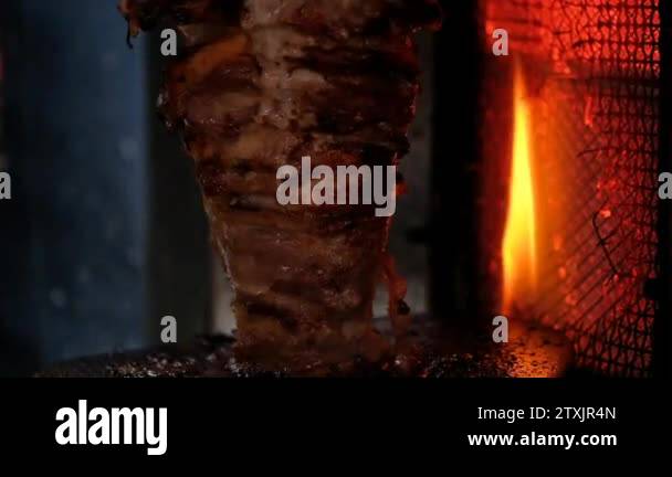 Traditional Turkish food Doner Kebab. Turnspit skewing kebap or kebab ...
