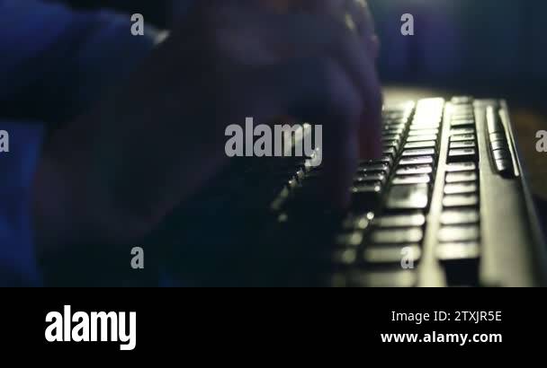 Typing on keyboard at night. Dark background lighting. Close-up Stock ...