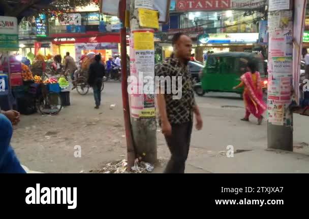 Unidentified people and street traffic at the Ring Road in the Adabor district of Dhaka, the ...