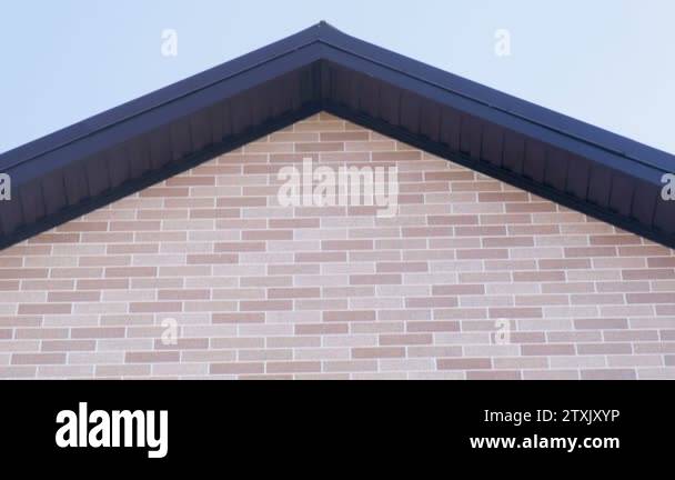 Roof of the country house front view. Facing panels as a brick. House ...