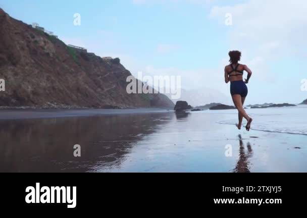 Jogging on the beach with an empty camera stabilizer. without people ...